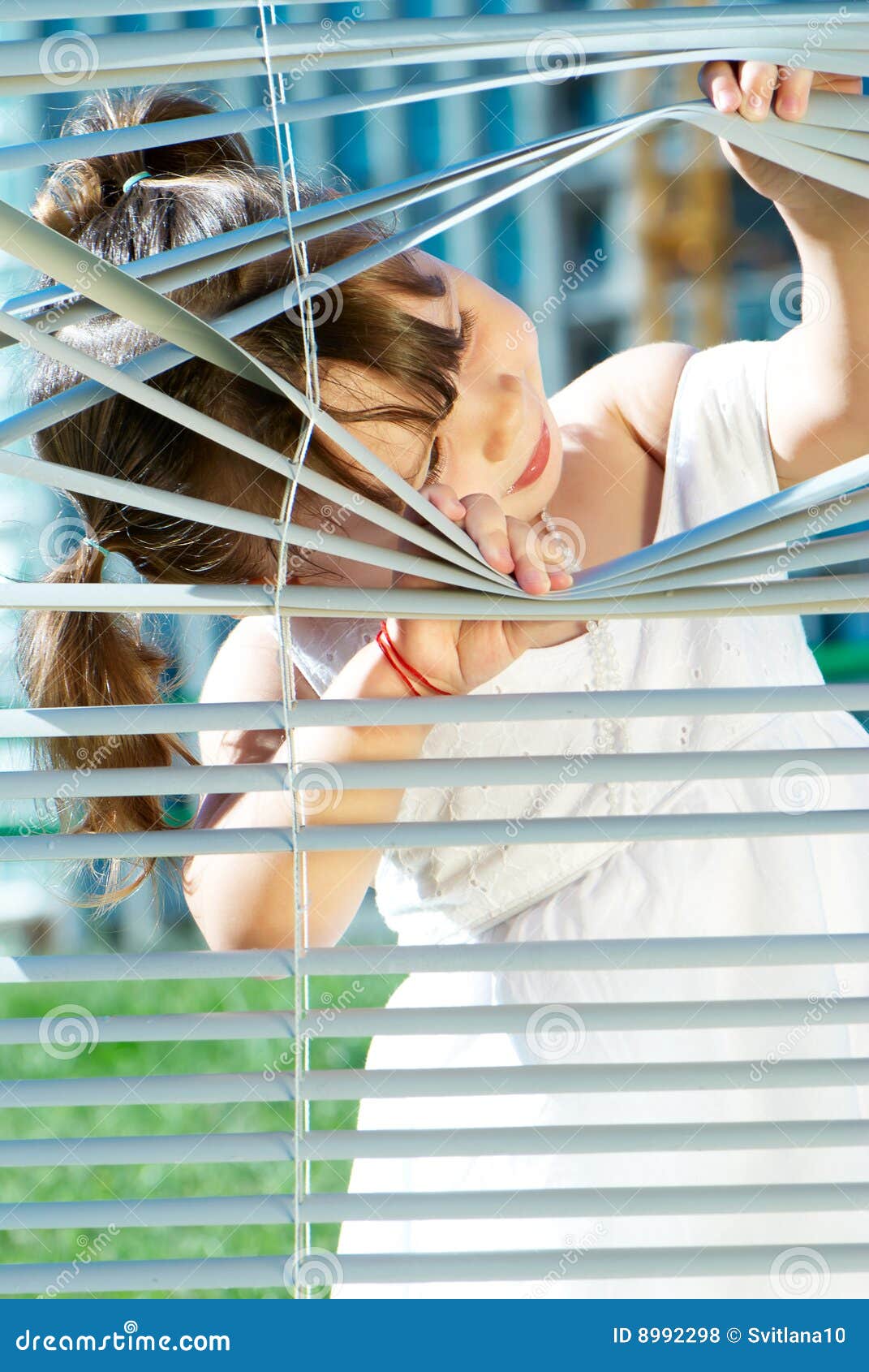 Little Girl Looking through the Blinds Stock Photo - Image of interest ...