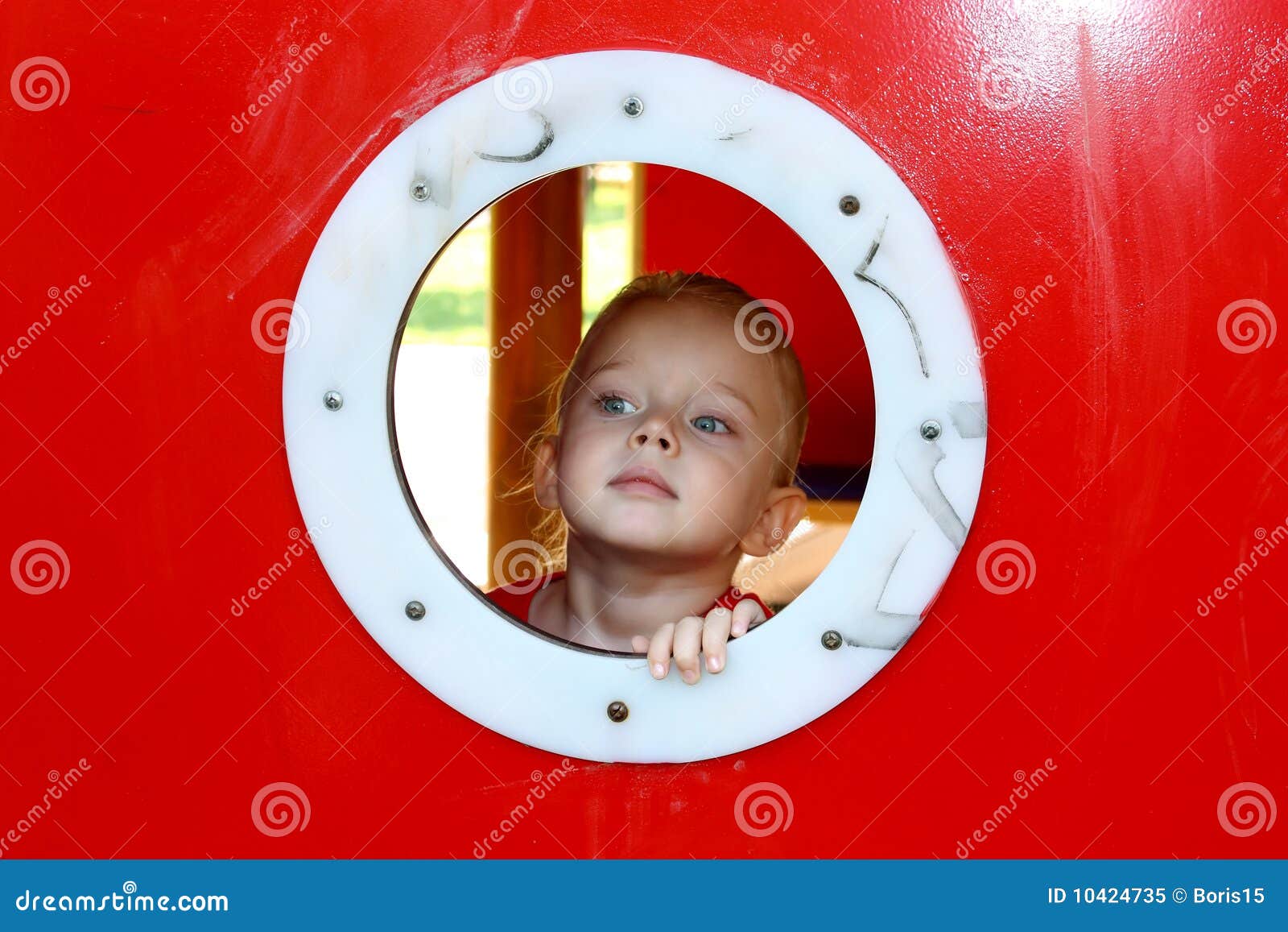 Little Girl Looking through Circle Window Stock Image - Image of young ...