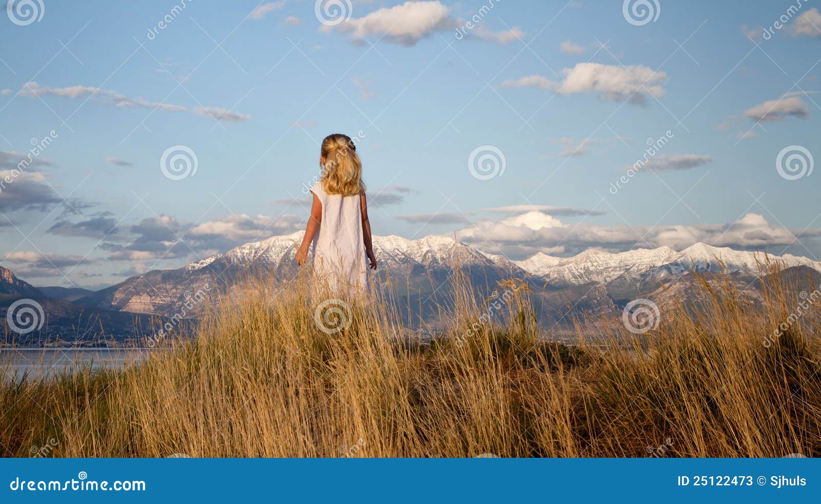 Little Girl Looking into a Mountain Landscape Stock Image - Image of ...