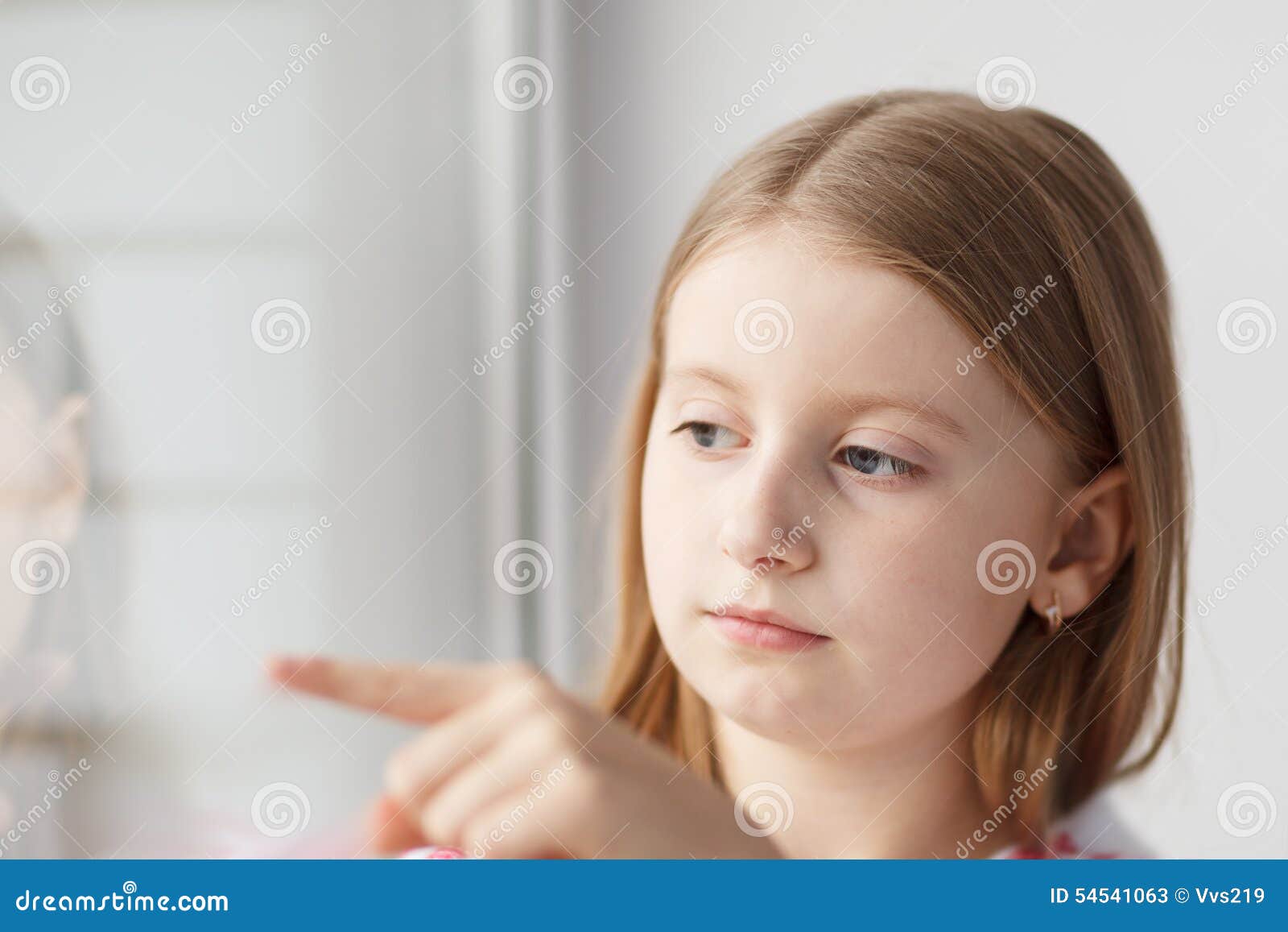 Little Girl Looking Out and Points with Finger the Window Stock Image ...