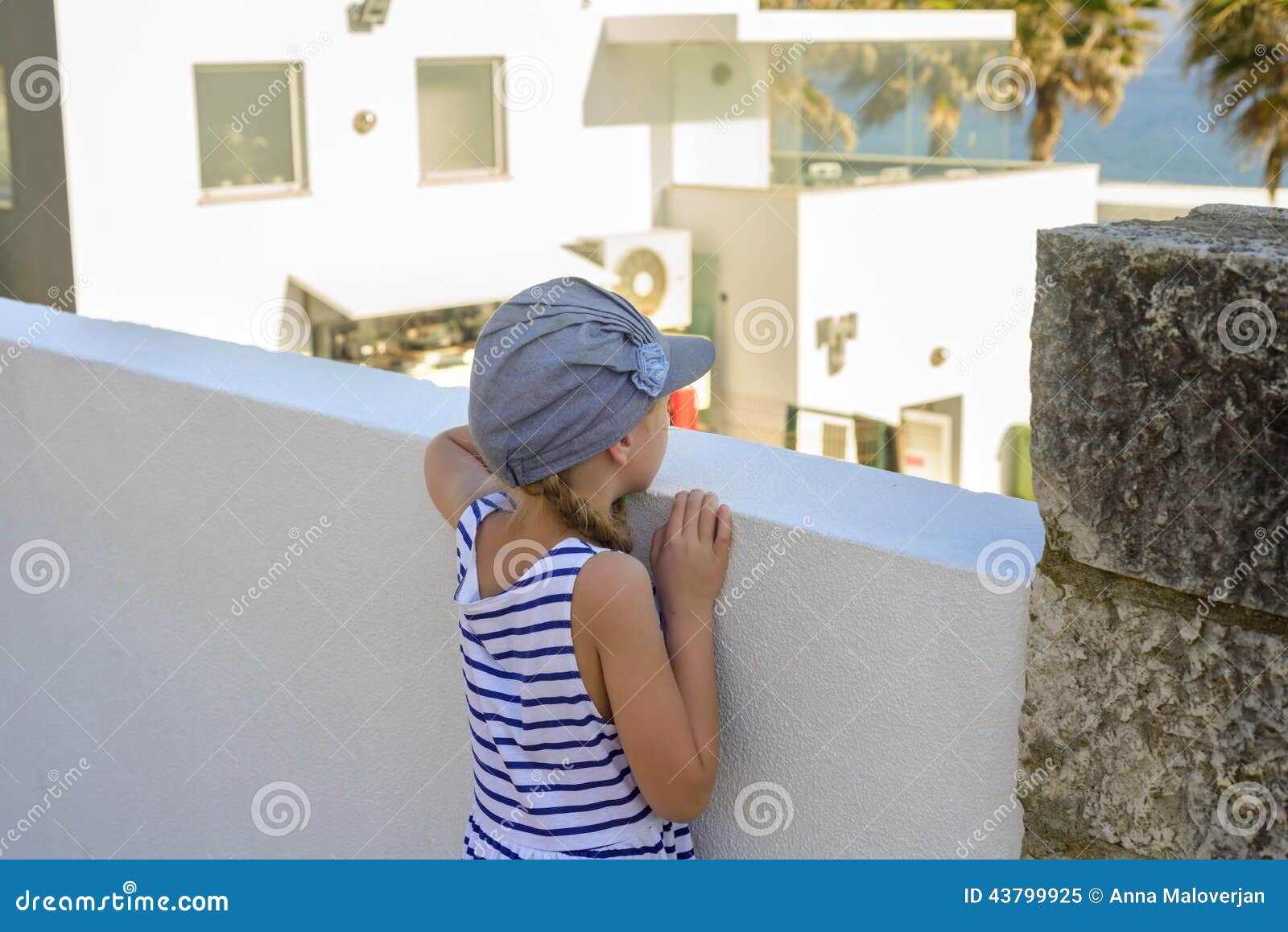 Little Girl Looking through a Wall Stock Image - Image of pretty, town ...