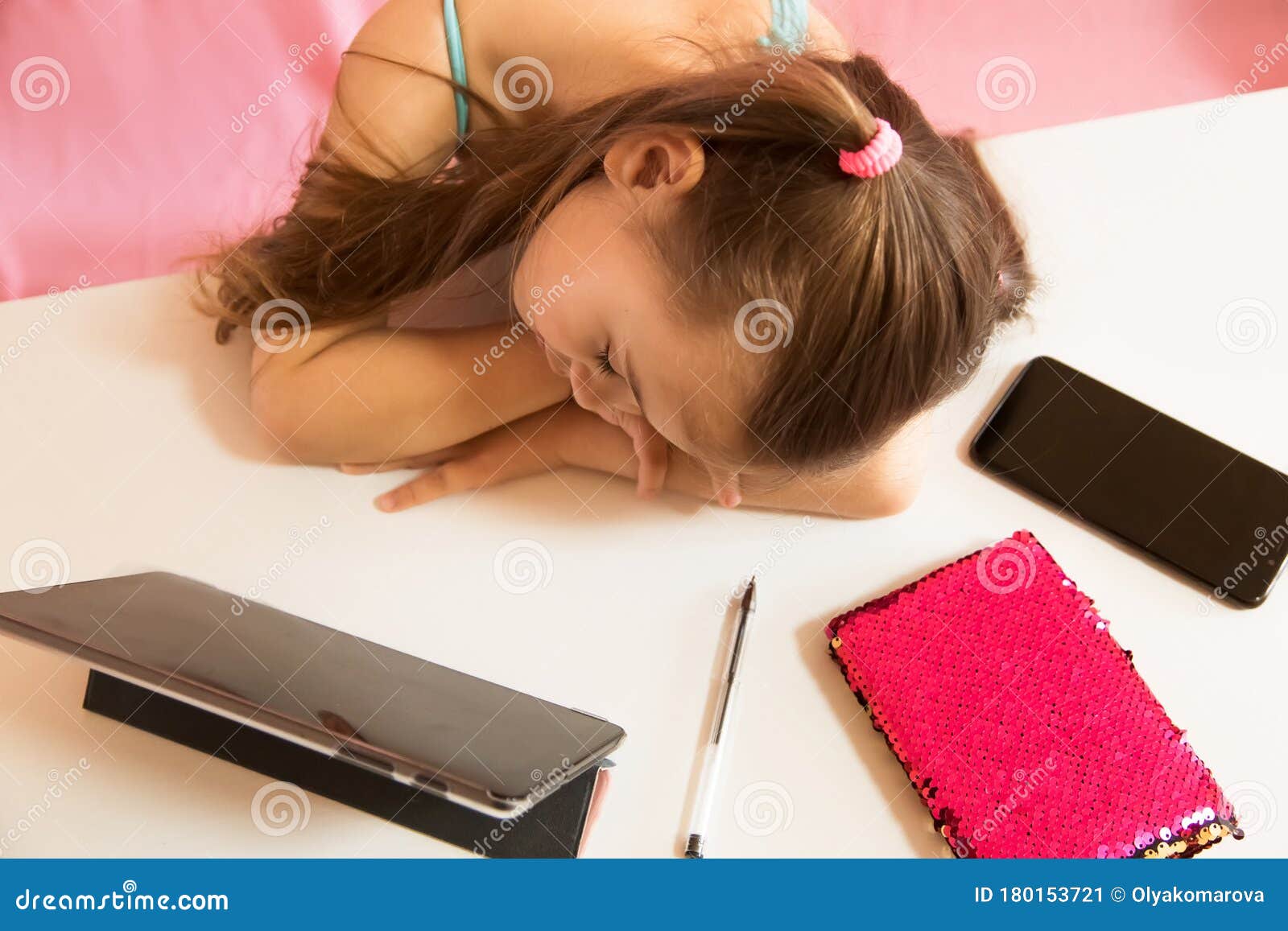Little Girl is Lying on the Table Tired of Doing Homework Stock Image ...