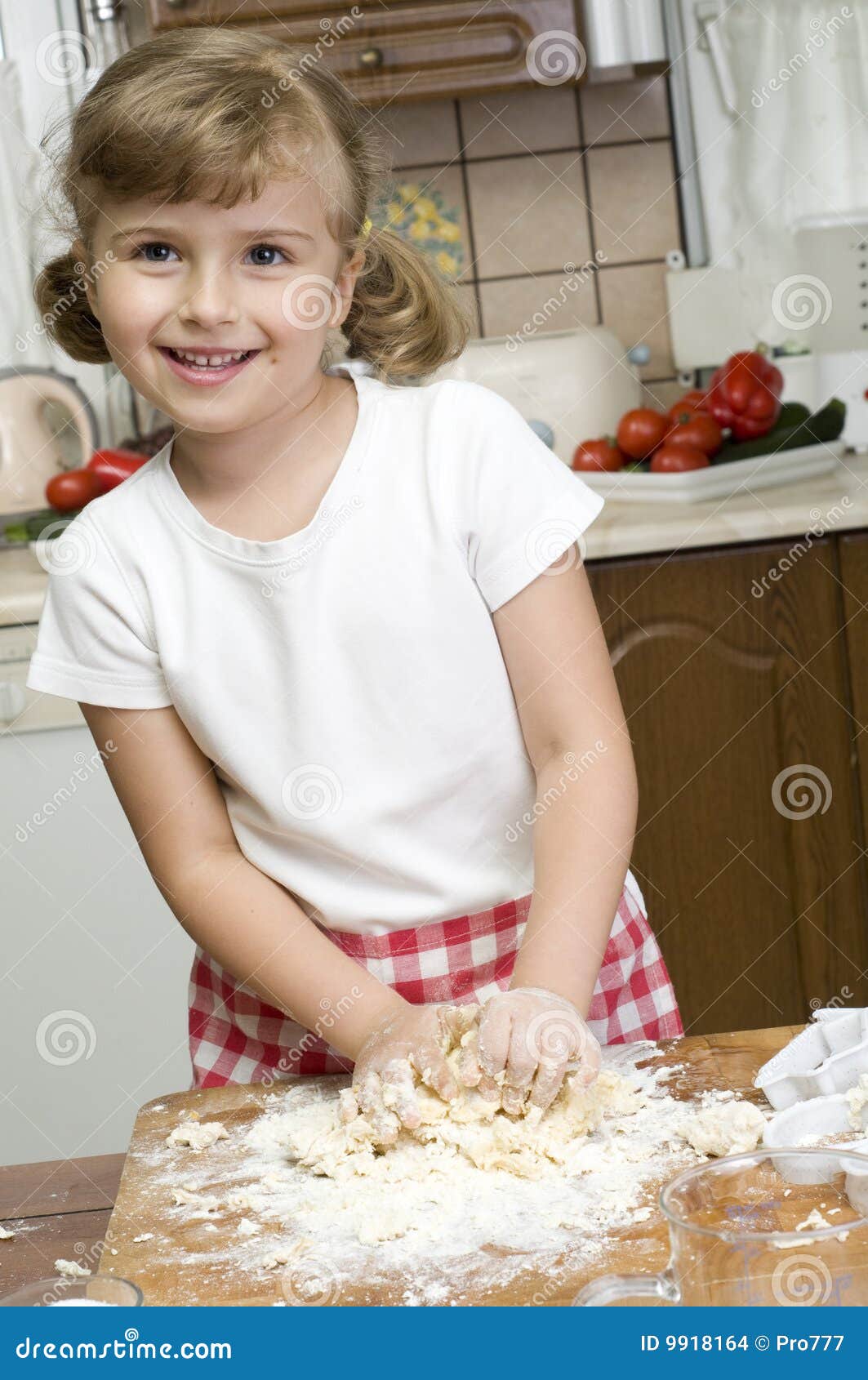 Little girl making cookies stock photo. Image of female - 9918164