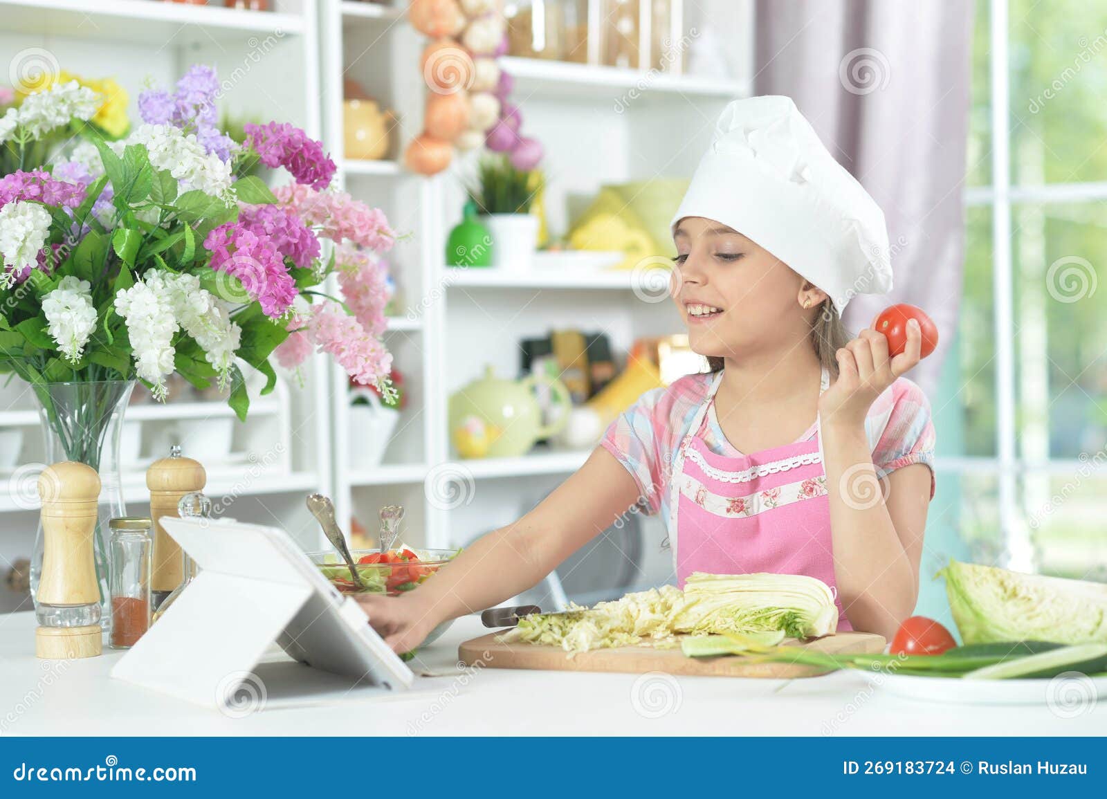 Little Girl Making Dinner on Kitchen Table at Home Stock Photo - Image ...