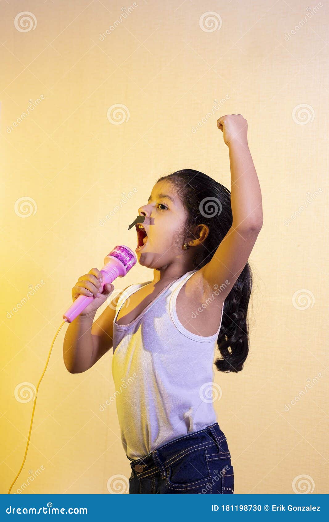 Little Girl with a Mustache Singing Using Her Microphone Stock Photo ...