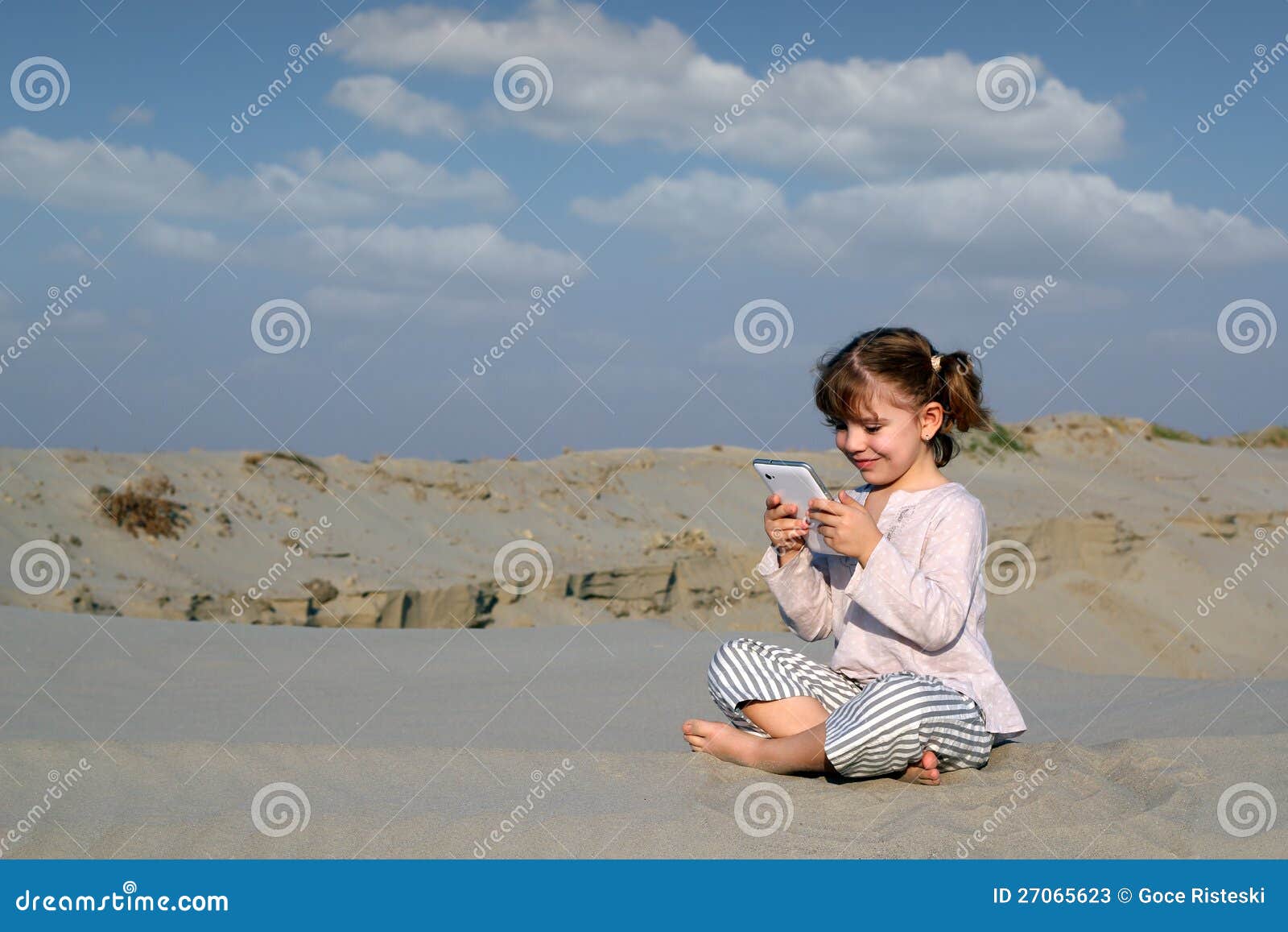 Little Girl Play with Tablet Pc in Desert Stock Image - Image of ...