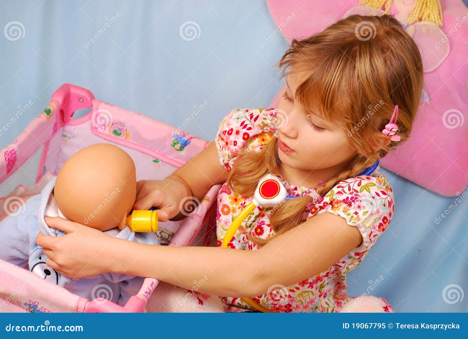 Little Girl Playing with Baby Doll Stock Image - Image of blonde ...