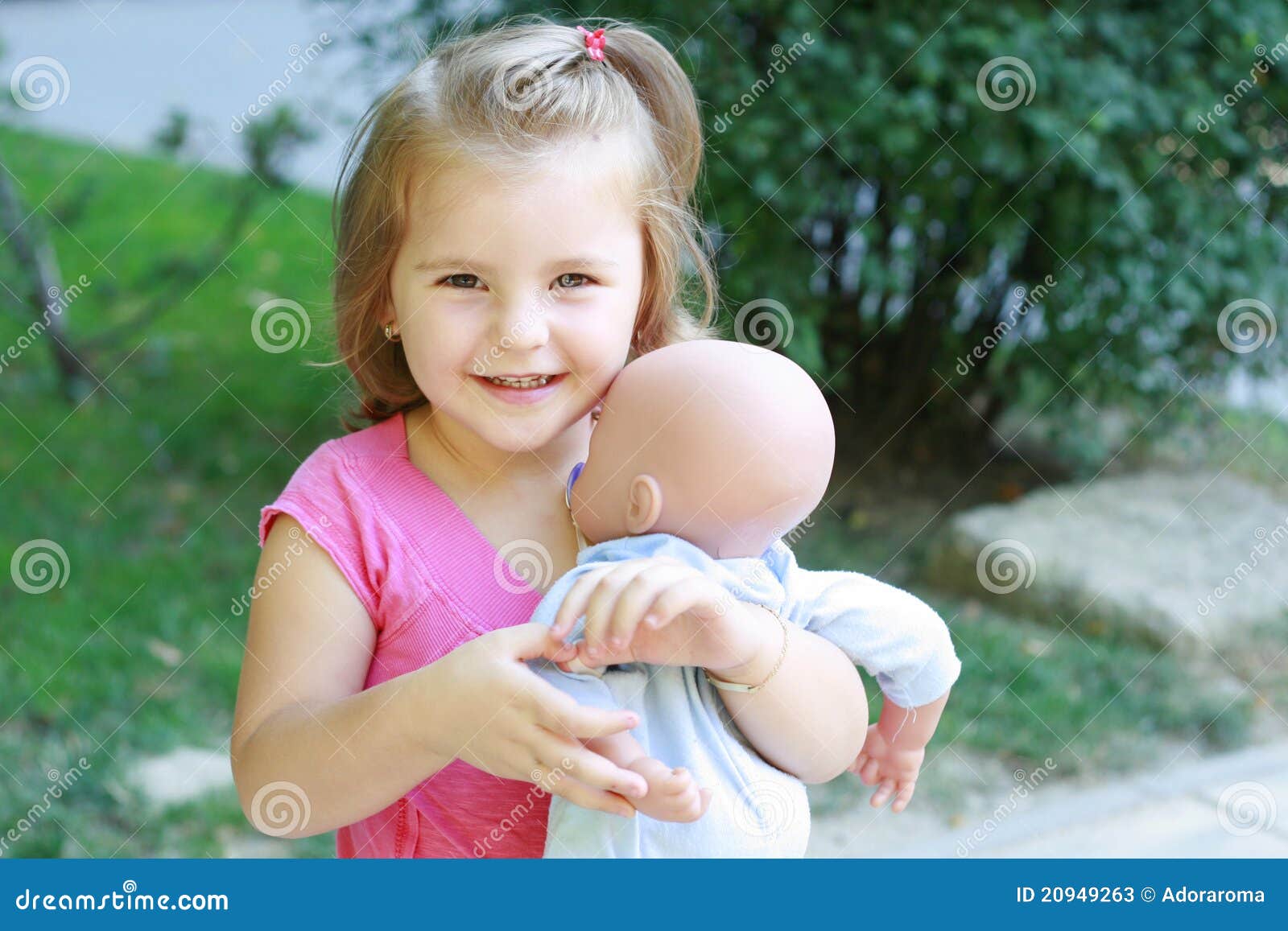 Little Girl Playing With Baby Dolls