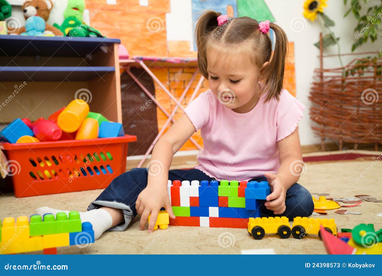 Little Girl is Playing with Building Bricks Stock Image - Image of ...