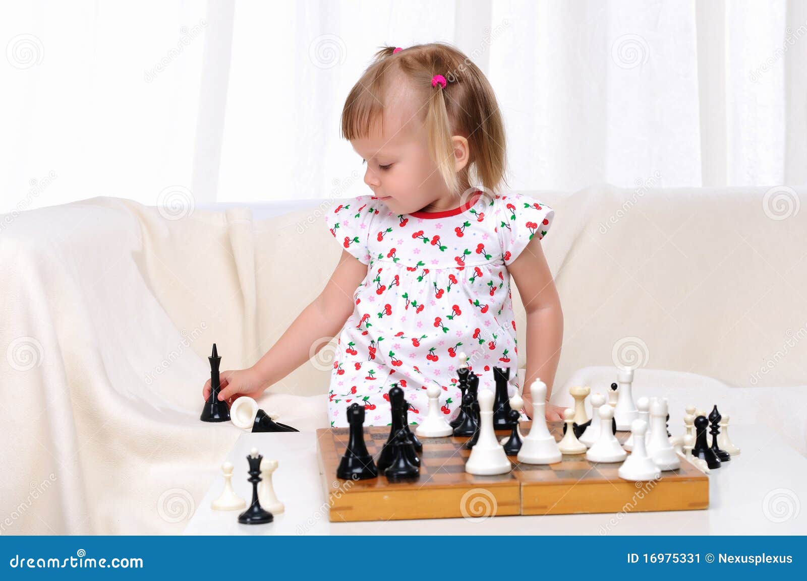 Little girl playing chess stock image. Image of adorable - 16975331