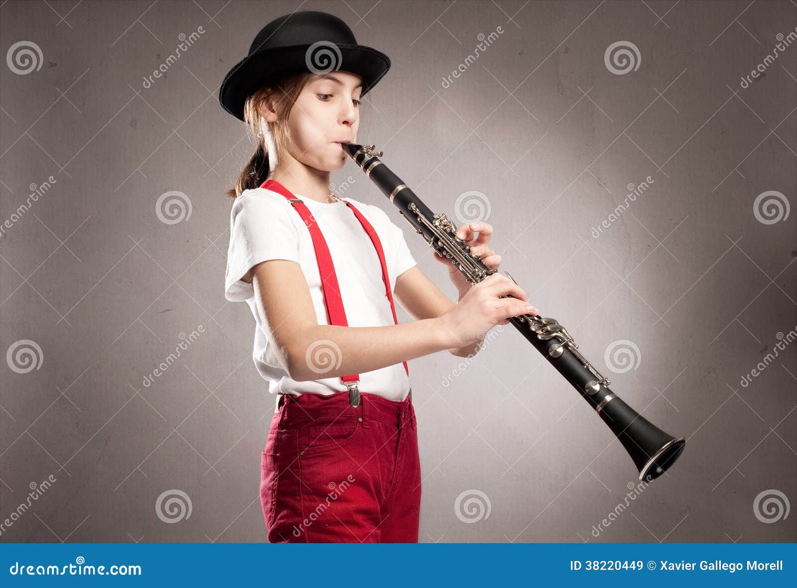 Little Girl Playing Clarinet Stock Image - Image of girl, face: 38220449