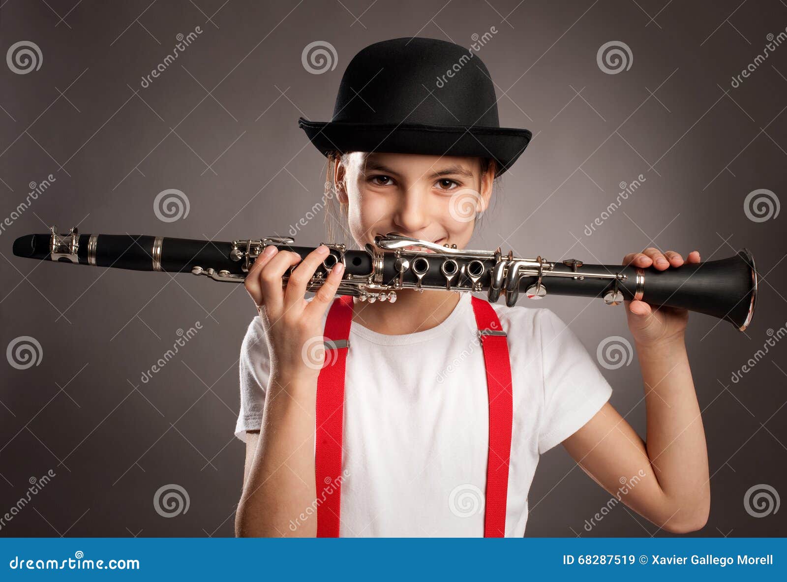 Little Girl Playing Clarinet Stock Image - Image of artist, bowler ...
