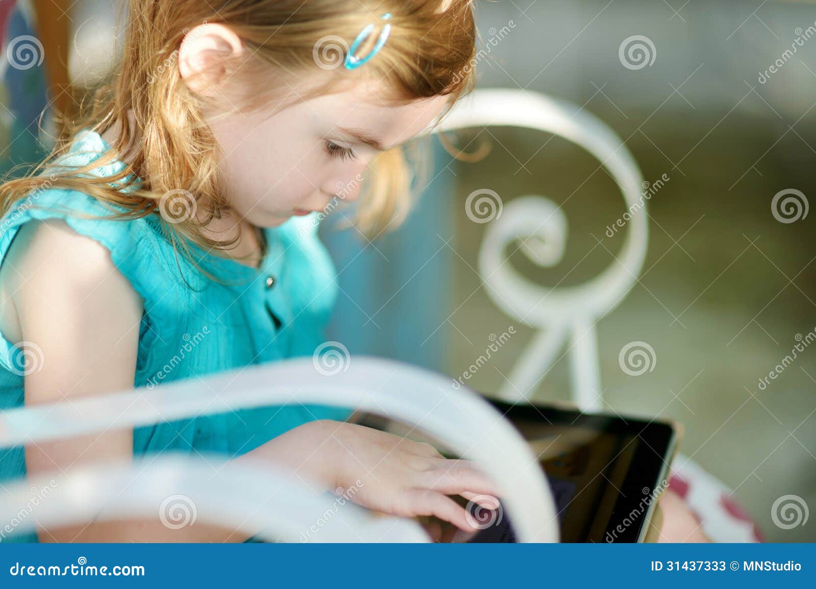 Little Girl Playing on a Digital Tablet Stock Image - Image of female ...