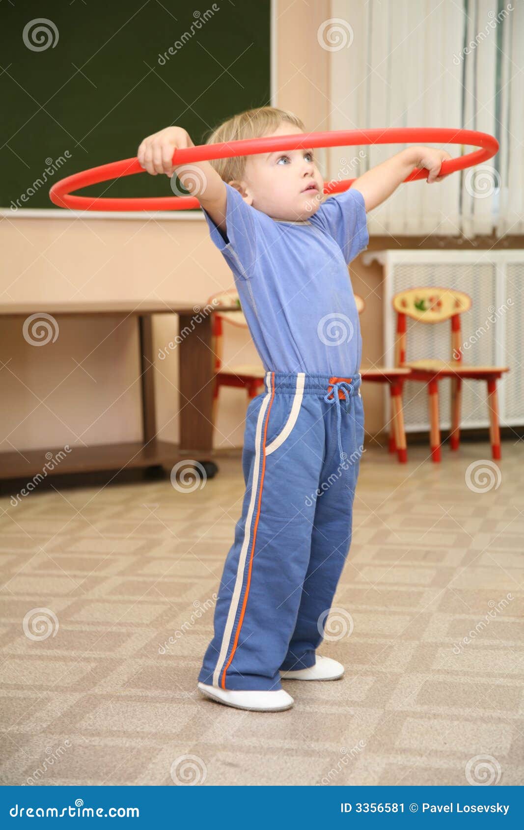 Little Girl Playing with Hula Hoop Stock Image - Image of playful, hand ...