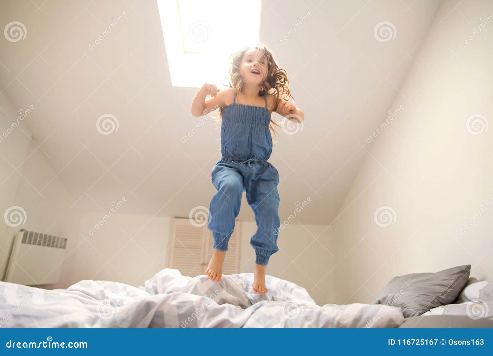 Little Girl Playing and Jumping at Home Stock Image - Image of happy ...