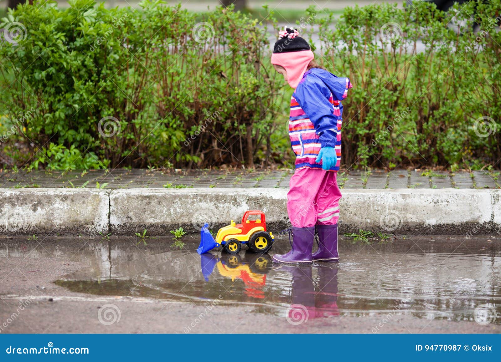 Little Girl Playing in the Puddle Stock Image - Image of cute, play ...