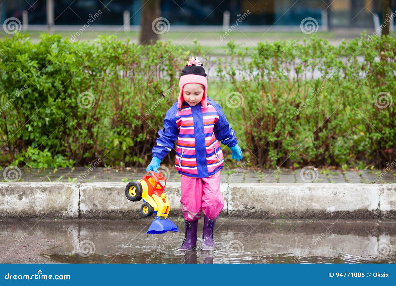 Little Girl Playing in the Puddle Stock Image - Image of rainy, little ...