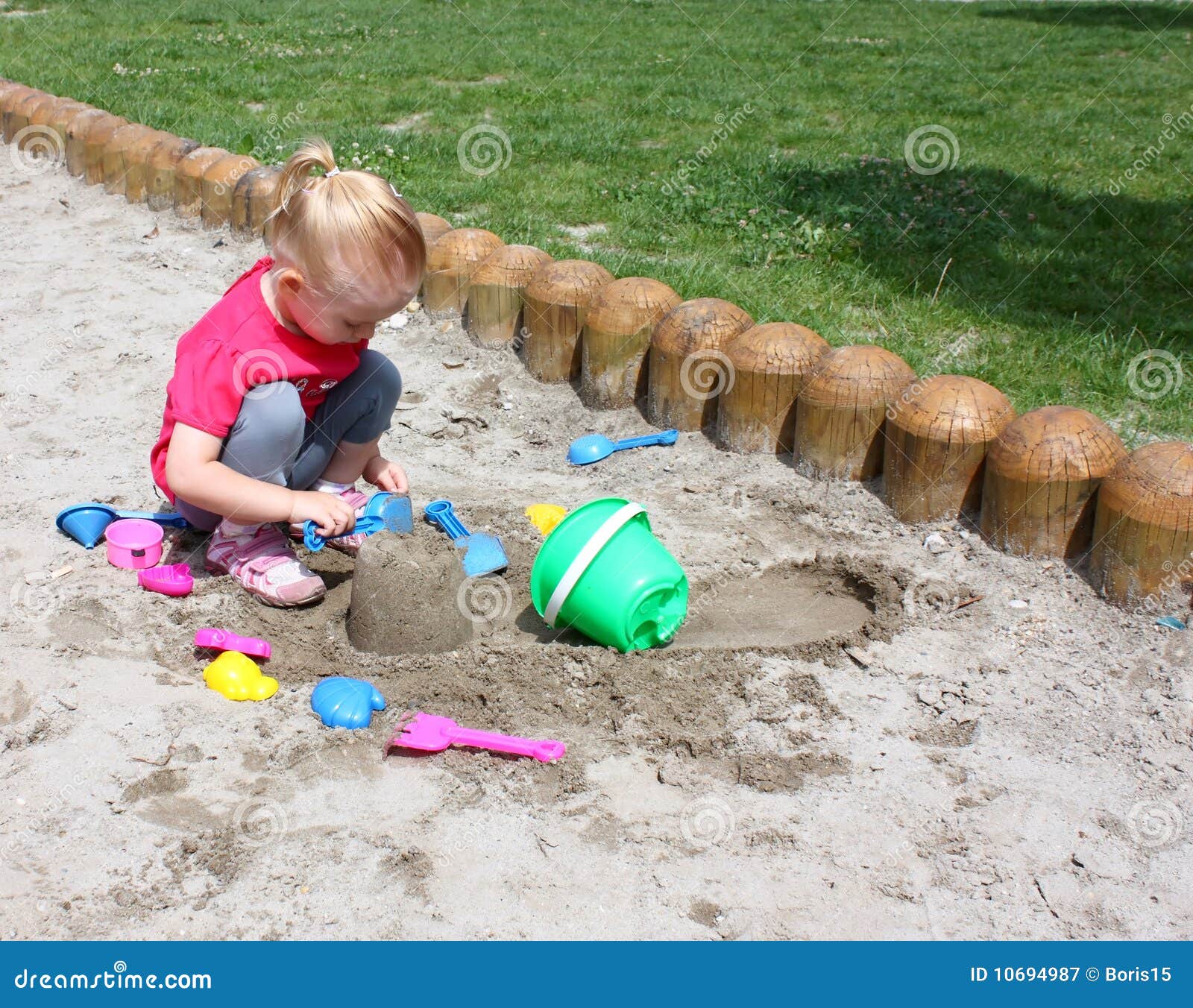 Little Girl Playing in the Sand Stock Image - Image of outdoor, girl ...