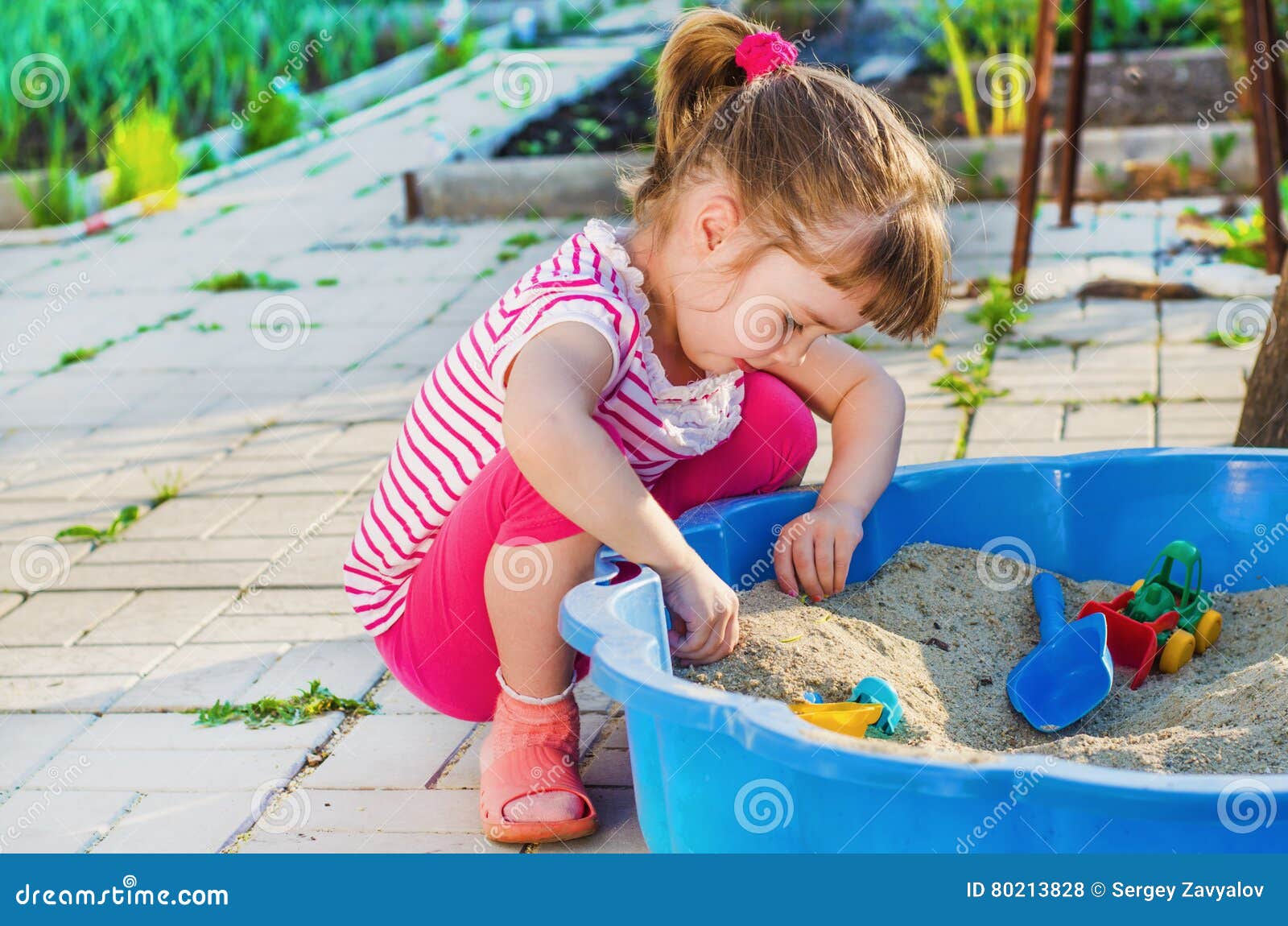 Little Girl Playing in a Sandbox Stock Photo - Image of nice, bright ...