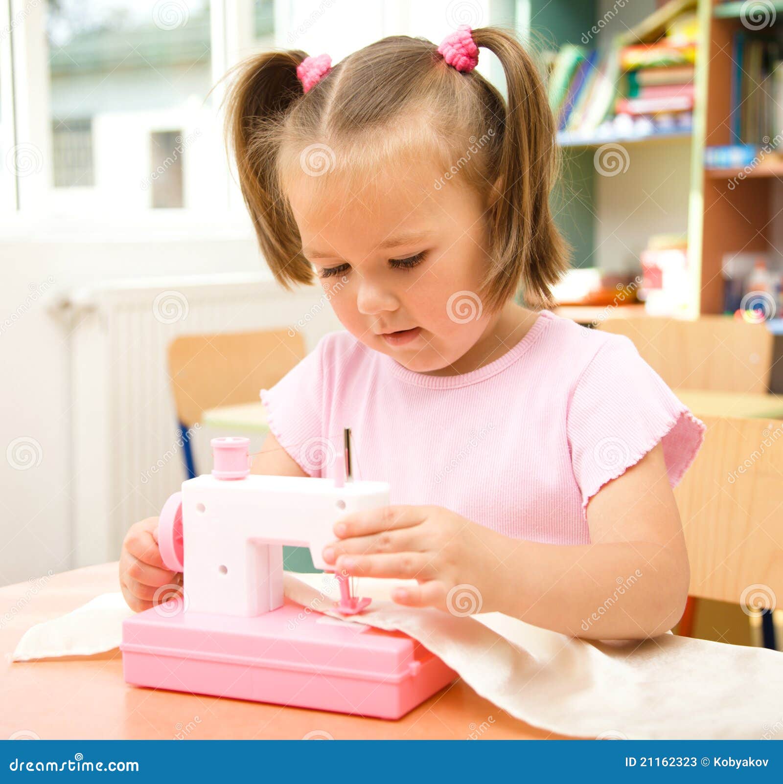 Little Girl is Playing with Sewing Machine Stock Image - Image of ...
