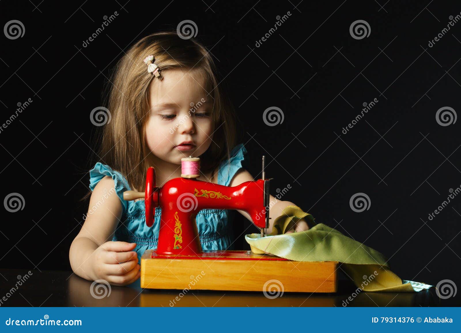 Little Girl is Playing with Sewing Machine Stock Photo - Image of ...