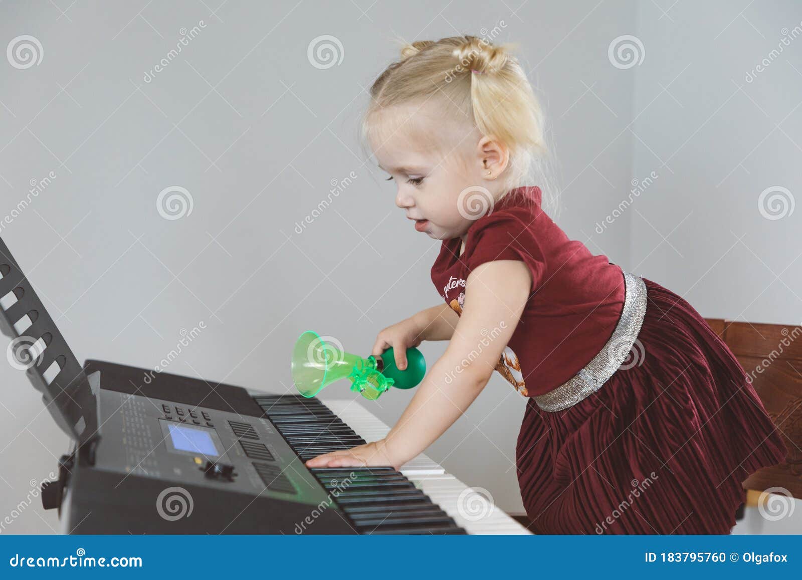 Little Girl Playing a Synthesizer Stock Photo - Image of person, child ...