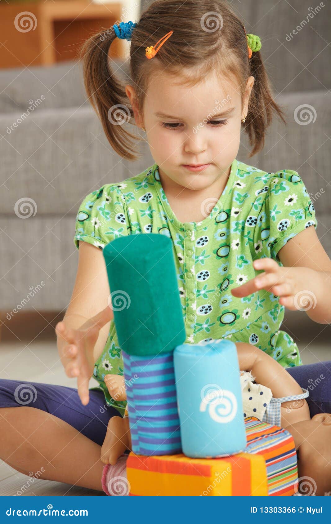 Little Girl Playing with Toy Blocks Stock Photo - Image of kids, couch ...