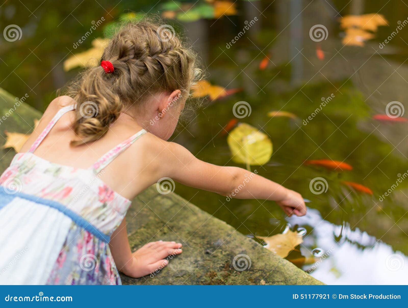 Little girl by the pond. stock image. Image of nature - 51177921