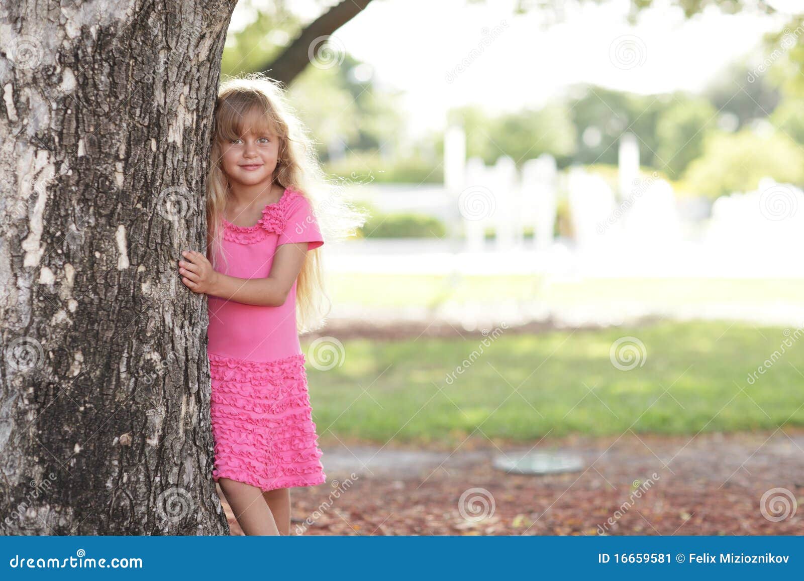 Little Girl Posing Behind the Tree Stock Image - Image of outside ...