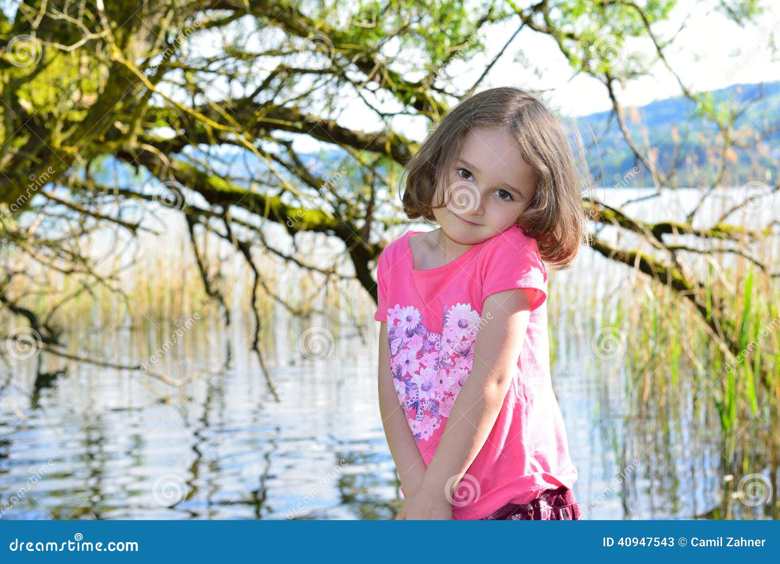 Little Girl Posing on a Lake Stock Image - Image of green, natural ...
