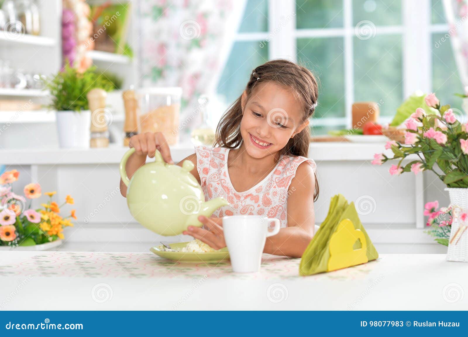 Little girl pouring tea stock image. Image of girl, kitchen - 98077983