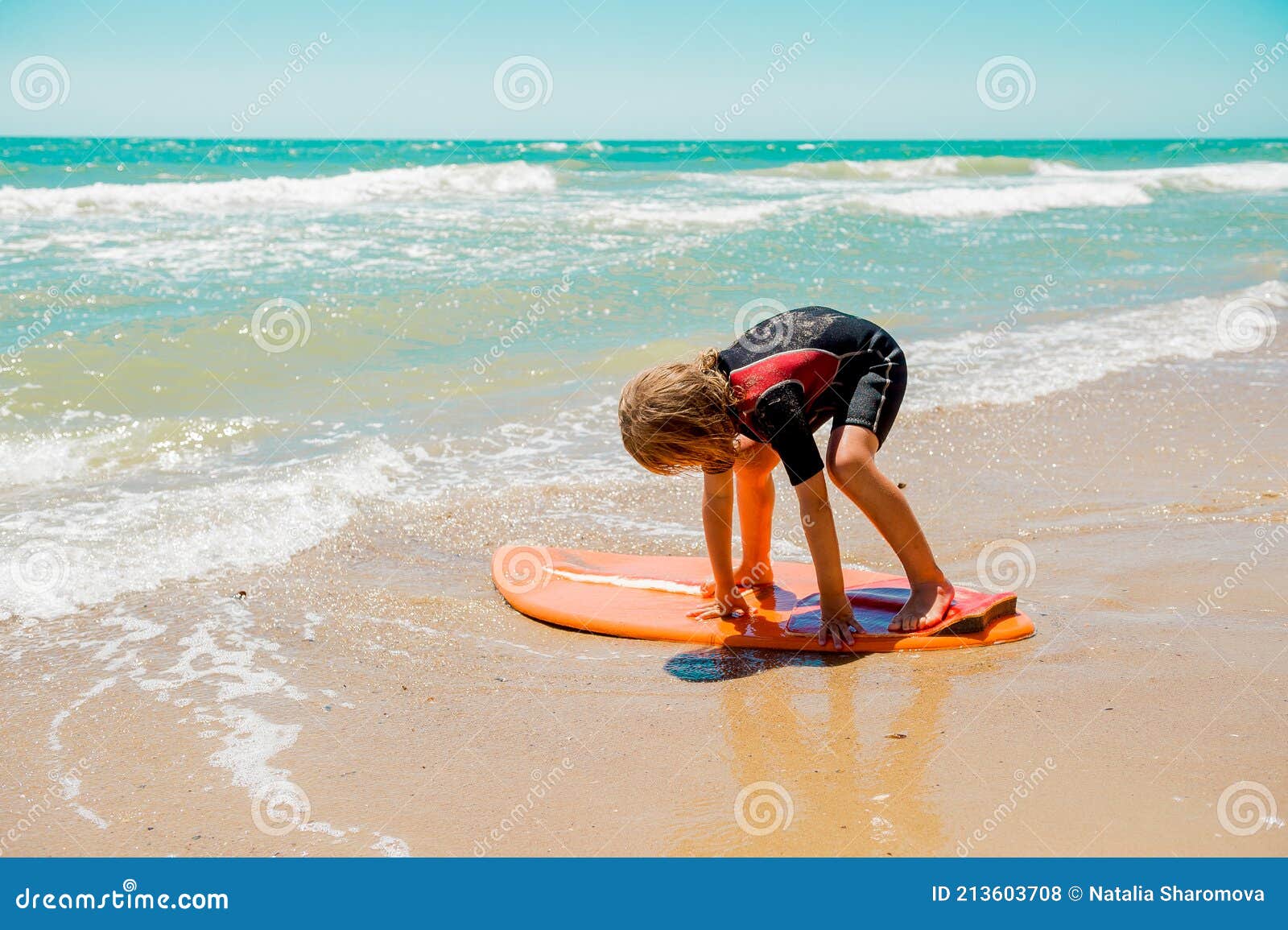Little Girl Practicing Surfing Position At Beach. Stock Photo ...