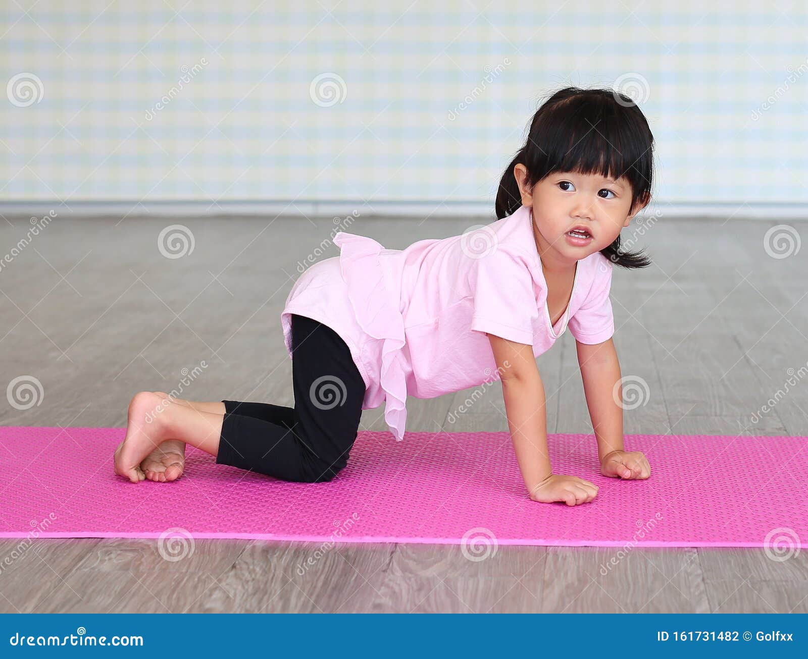 Little Girl Practicing Yoga or Exercise Stock Photo - Image of little ...