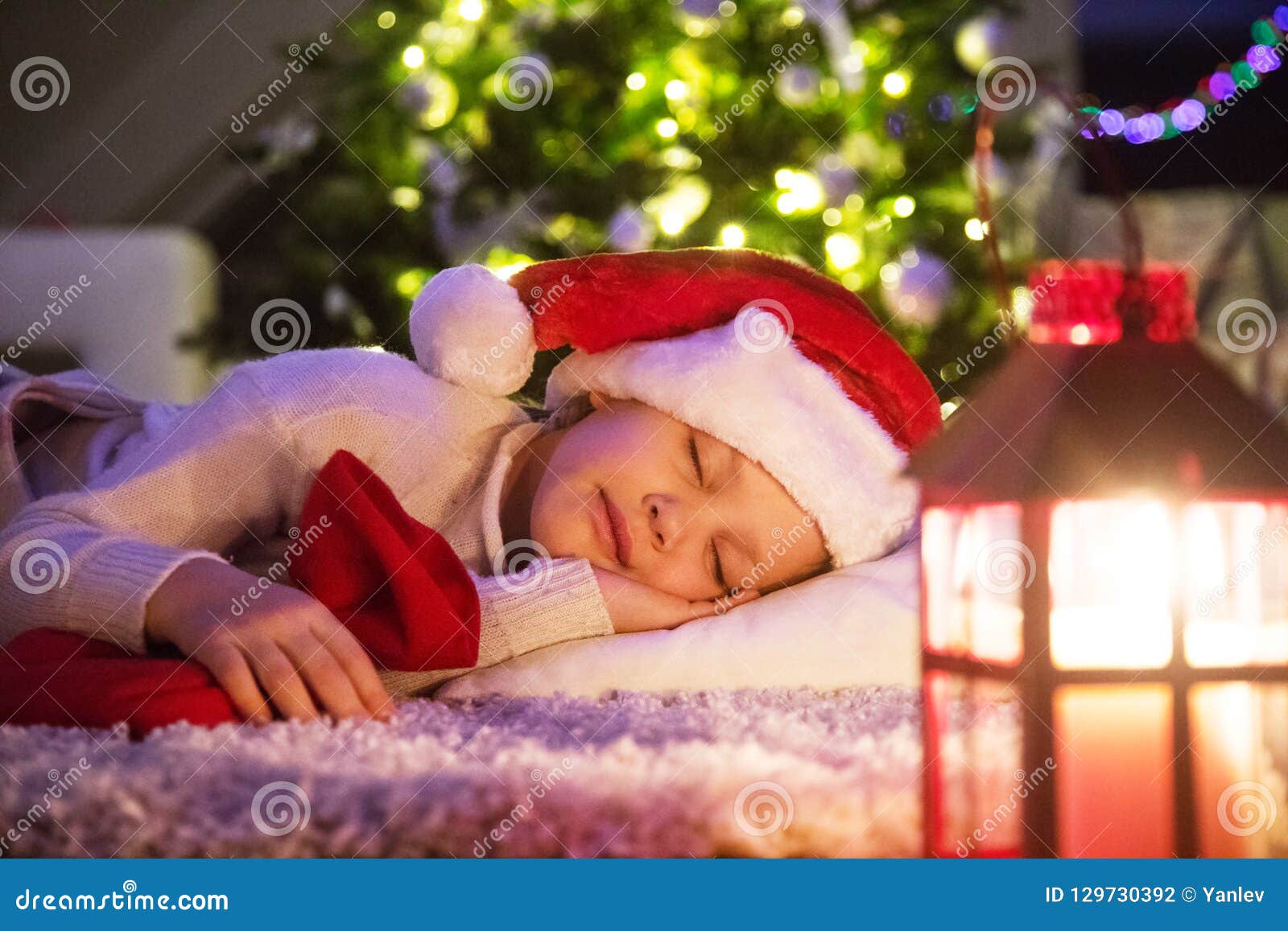 Little Girl Sleeping Under Christmas Tree Stock Photo - Image of ...