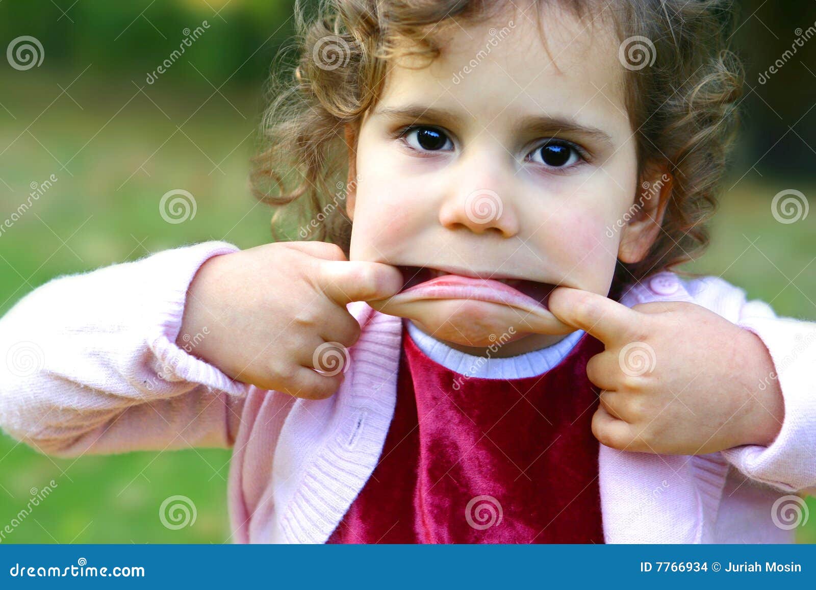 Little girl pulling faces stock photo. Image of expressive - 7766934