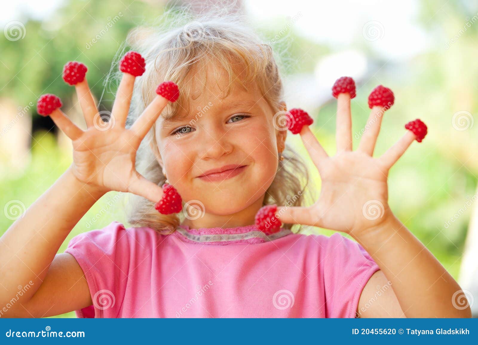 Little girl with raspberry stock photo. Image of preschooler - 20455620