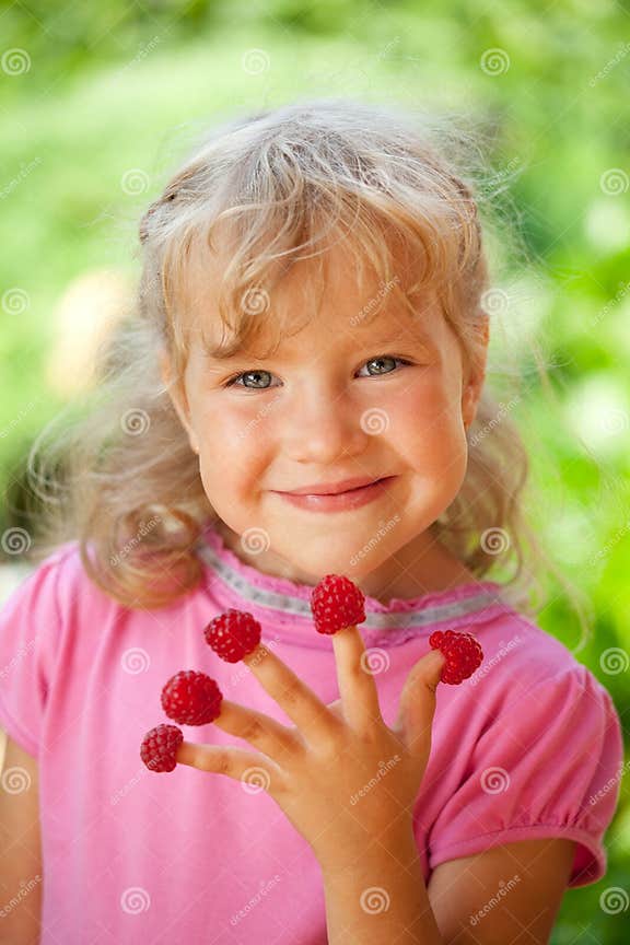 Little girl with raspberry stock image. Image of girl - 20455627