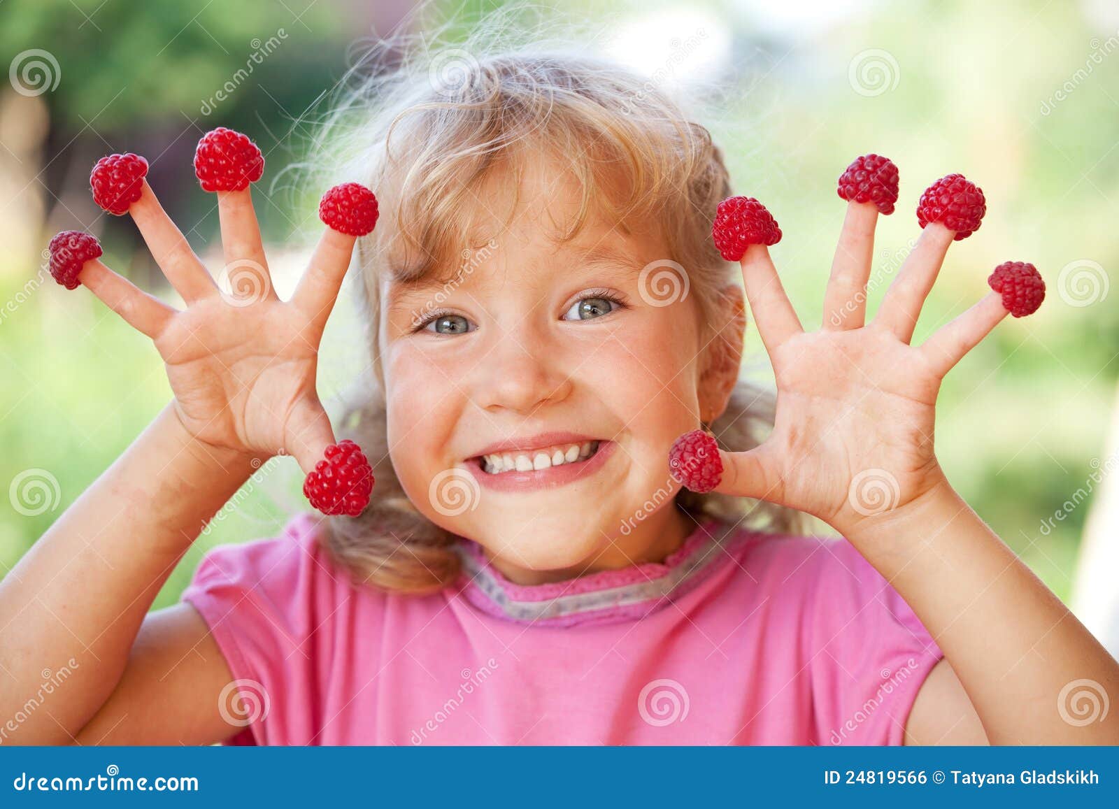 Little girl with raspberry stock photo. Image of nature - 24819566