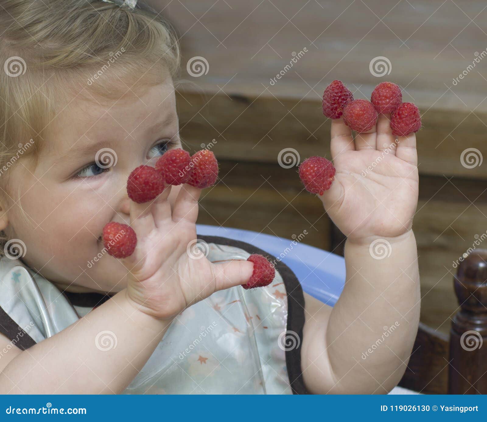 Little Girl with Raspberry on Fingers Stock Photo - Image of freshness ...
