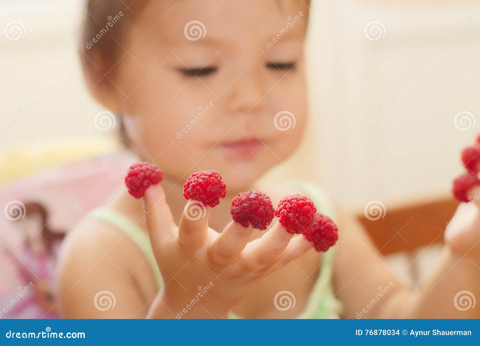 Little Girl with Raspberry on Fingers Stock Photo - Image of food ...