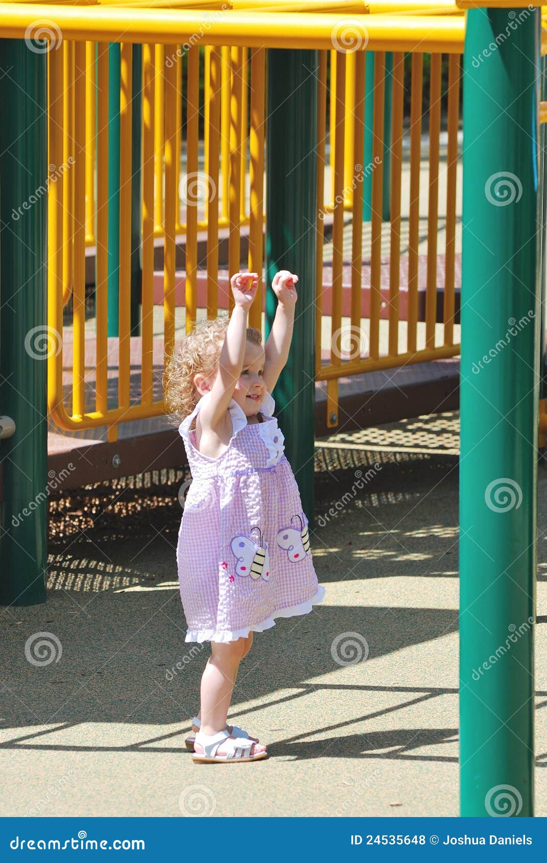 Little Girl Reaching for Bars Stock Photo - Image of climbing, girl ...