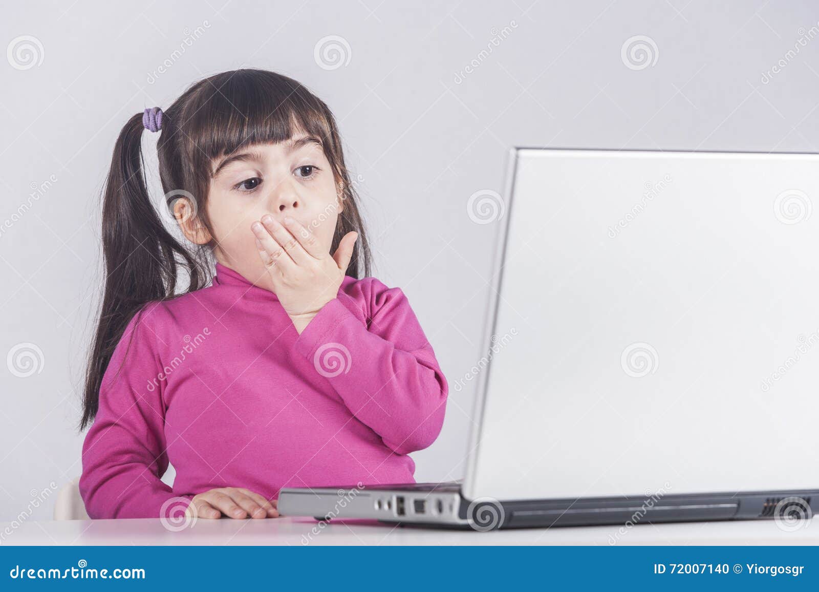 Little Girl Reacts while Using a Laptop Stock Photo - Image of ...