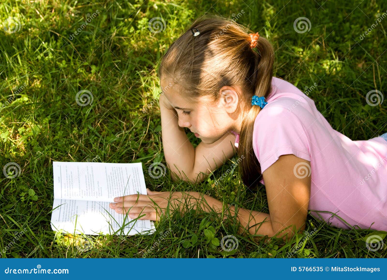 Little girl read book stock image. Image of flower, park - 5766535