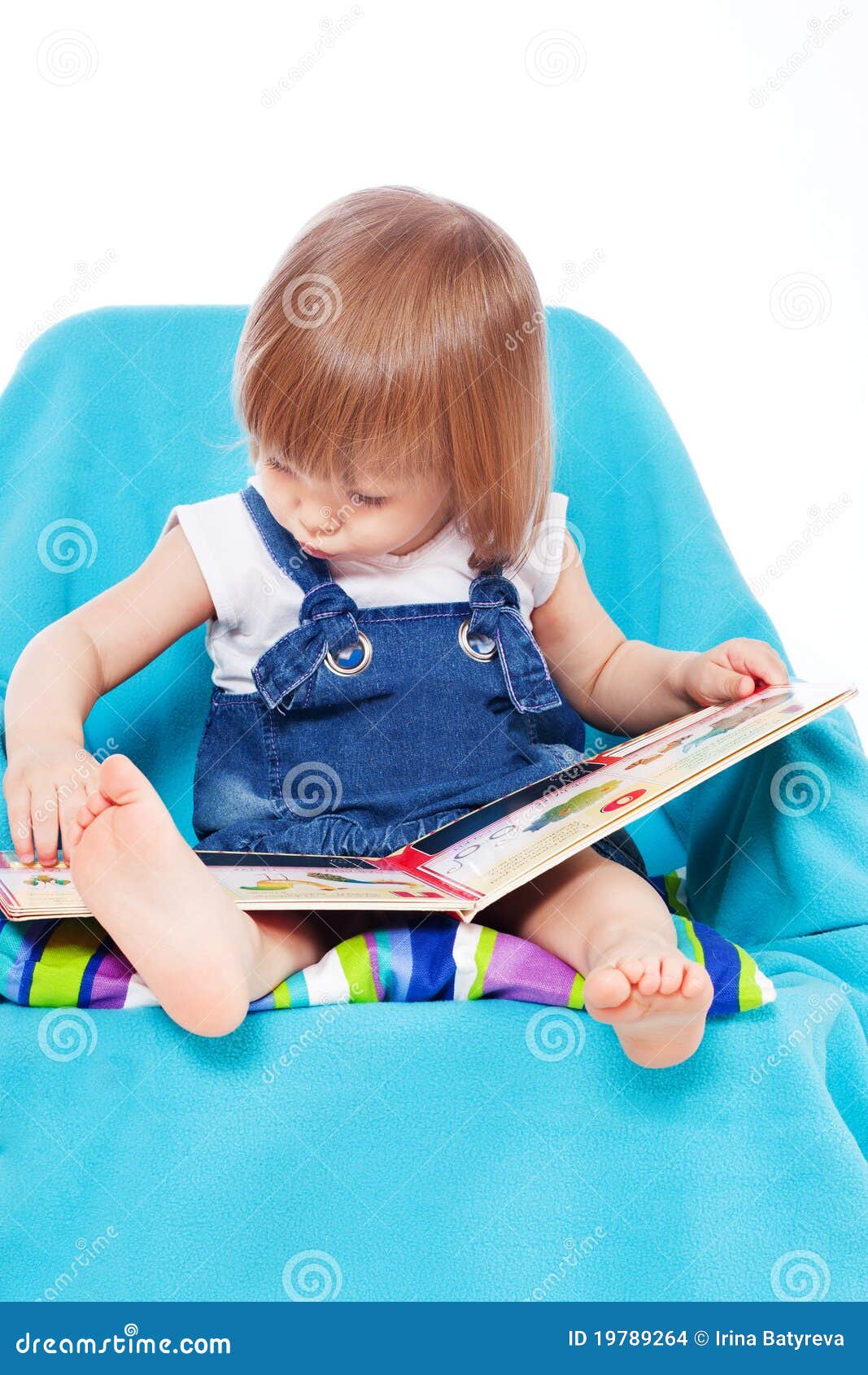 Little girl reading a book stock photo. Image of people - 19789264