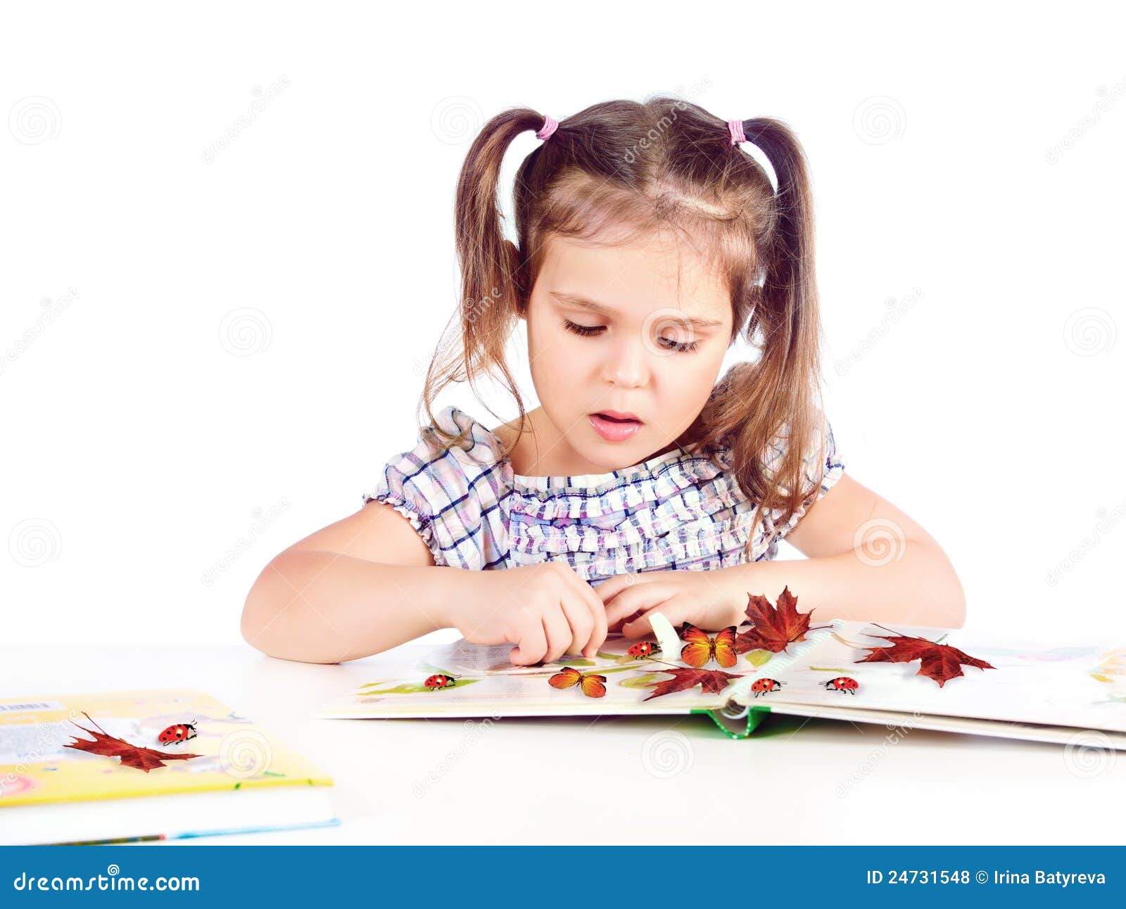 Little girl reading a book stock photo. Image of baby - 24731548