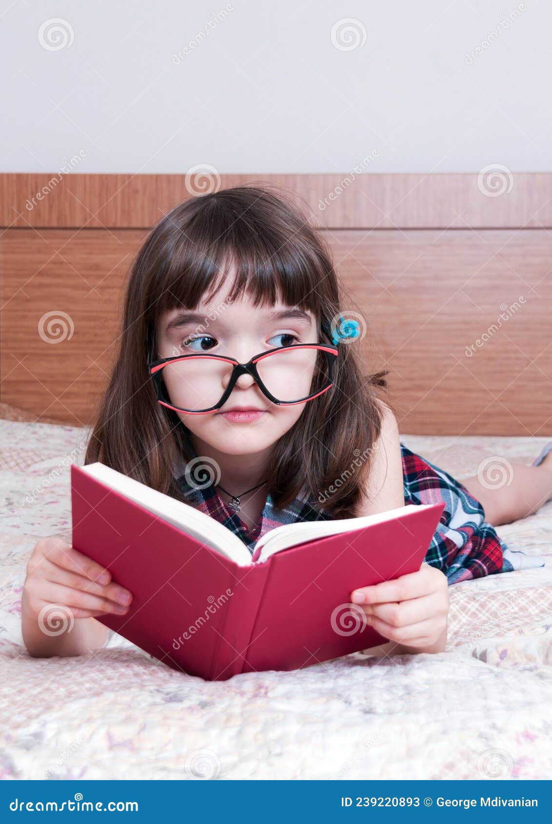 Little girl reading a book stock image. Image of cute - 239220893