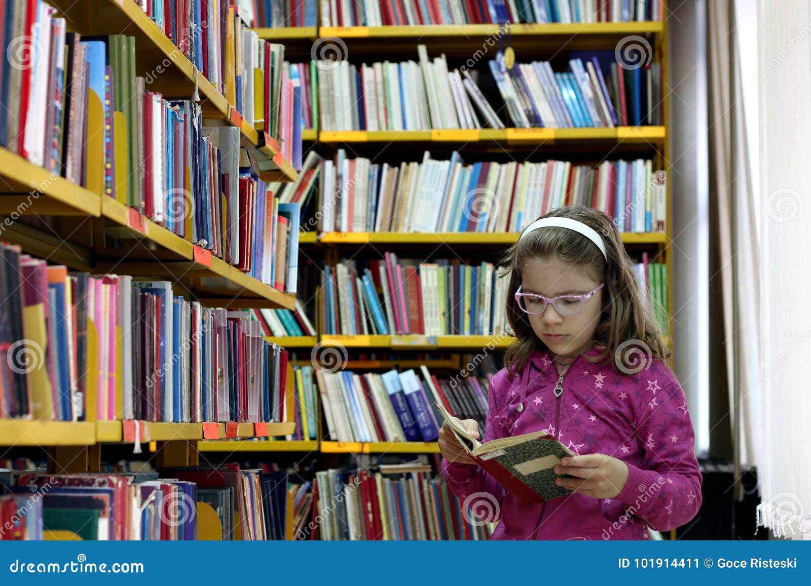 Little Girl Reading a Book in the Library Stock Image - Image of learn ...