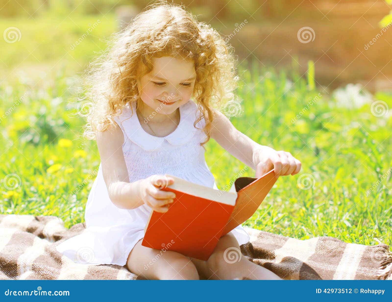 Little girl reading a book stock photo. Image of leisure - 42973512