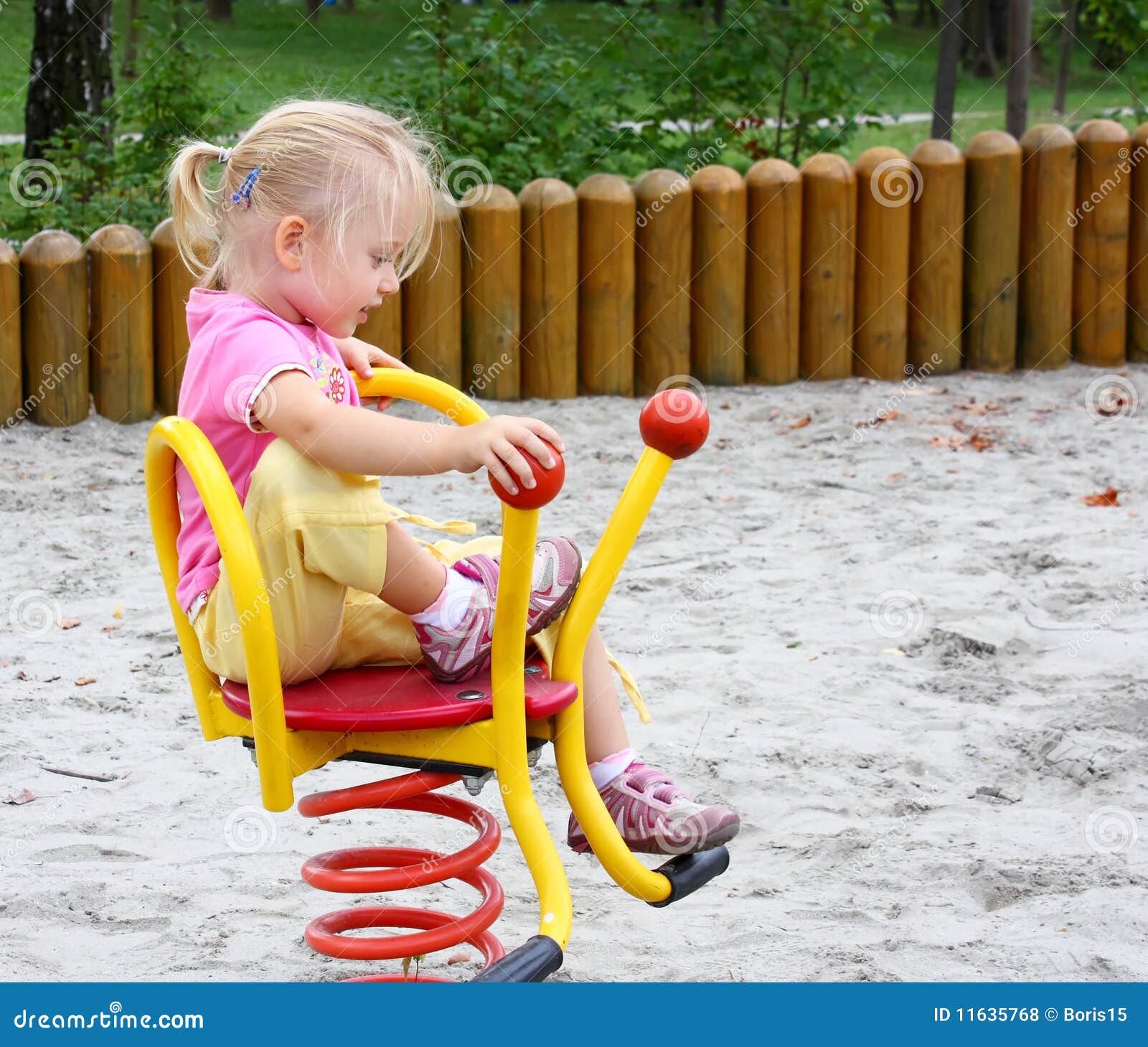 Little Girl Ridding Spring Swing Stock Photo - Image of park, caucasian ...
