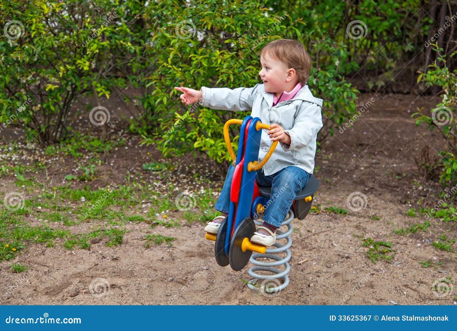 Little Girl Ridding Spring Swing Stock Image - Image of looking, park ...